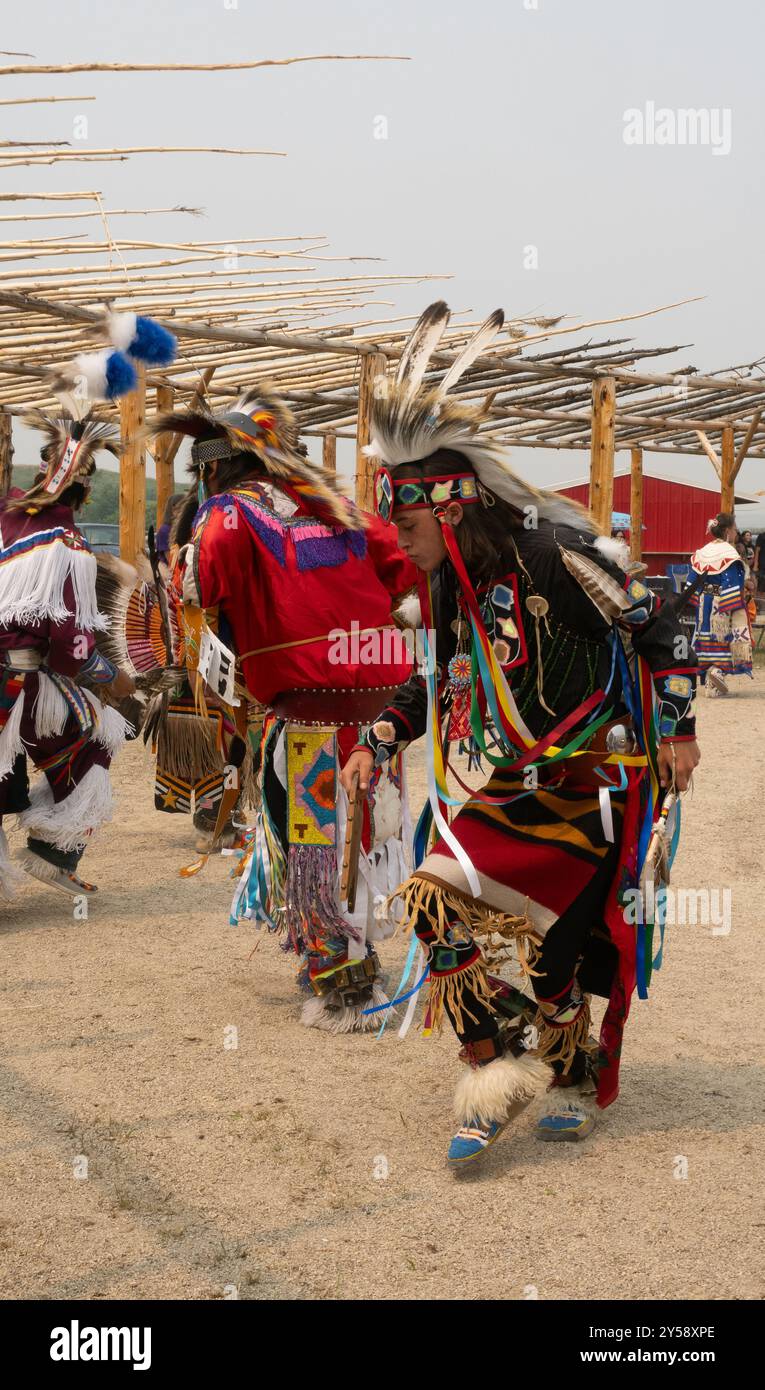 Traditional Native American male powwow dancers in full regalia dancing at the Lodgepole Pow Wow ...