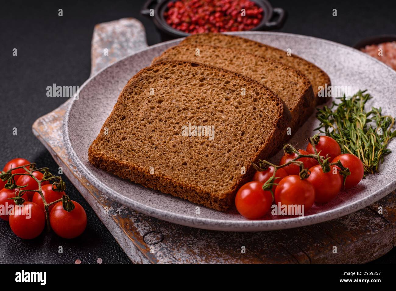 Fresh crispy brown bread sliced from whole grain flour with salt and ...