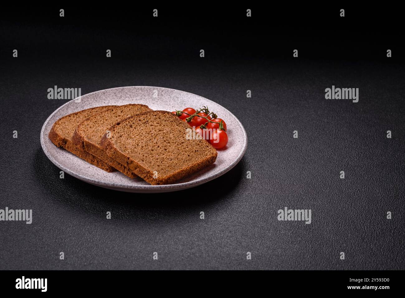 Fresh crispy brown bread sliced from whole grain flour with salt and ...
