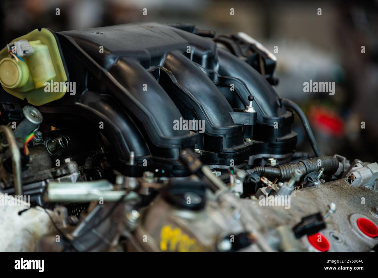A deconstructed car engine at a mechanic's garage Stock Photo - Alamy