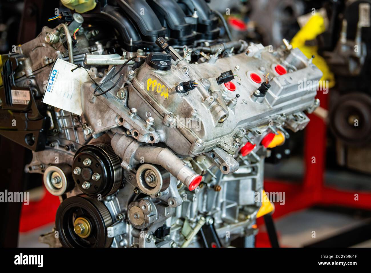 A deconstructed car engine at a mechanic's garage Stock Photo - Alamy