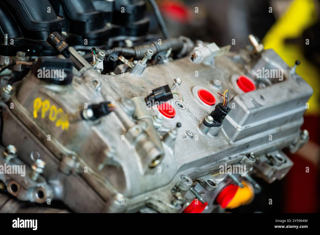 A deconstructed car engine at a mechanic's garage Stock Photo - Alamy