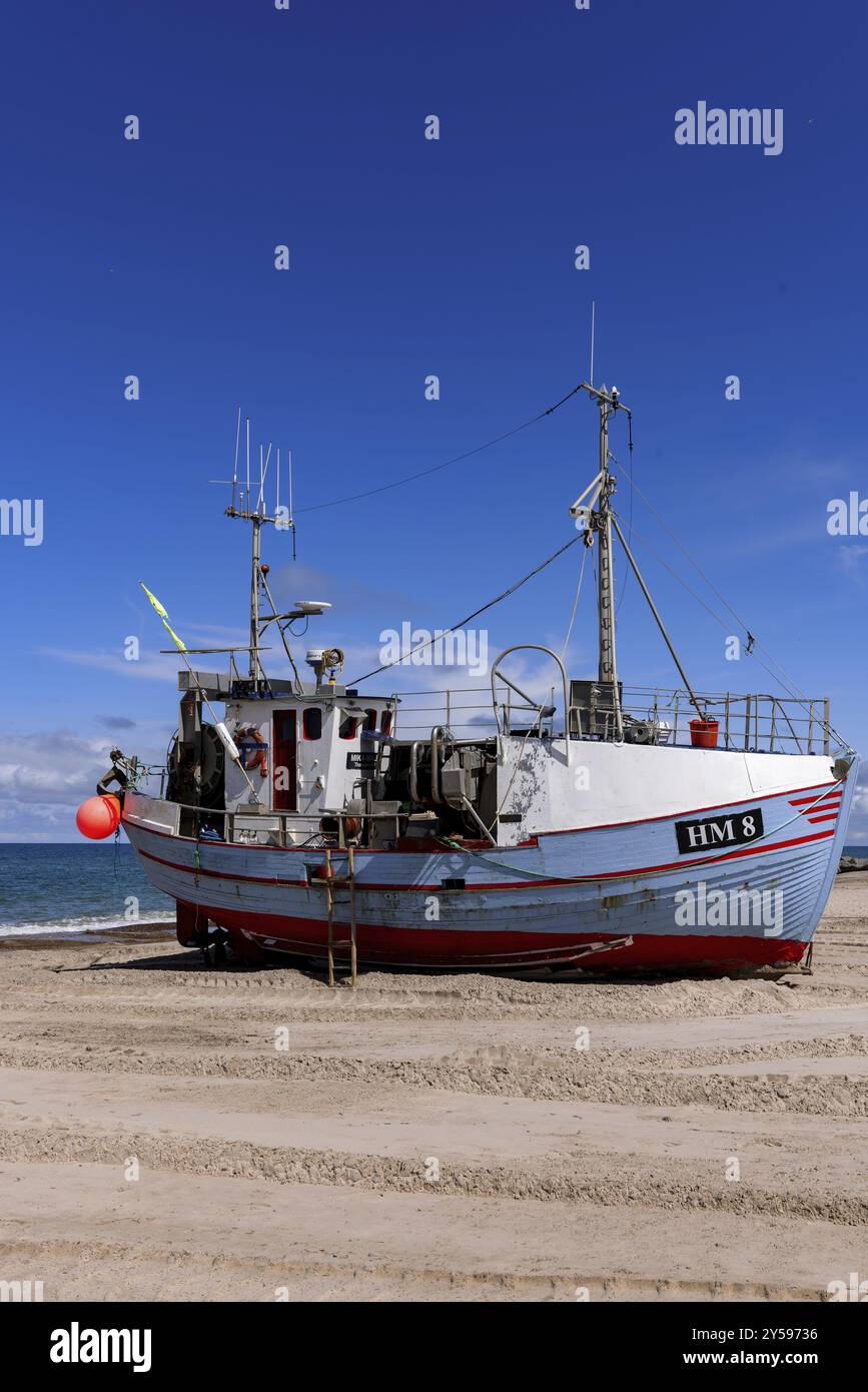 Fishing boat lying on the beach at thorup strand hi-res stock ...