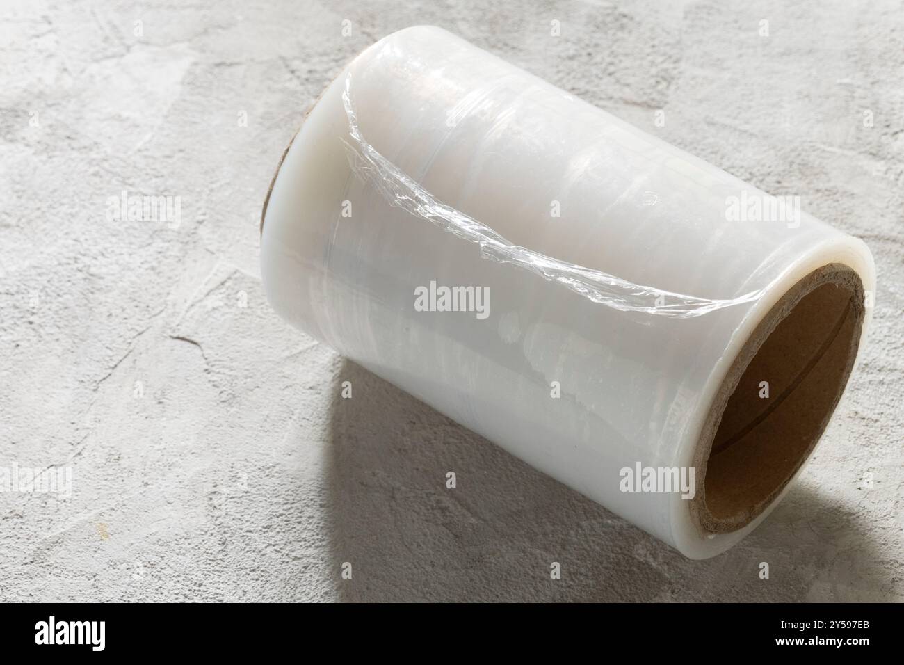 Polyethylene roll for packing, on a cement surface Stock Photo - Alamy