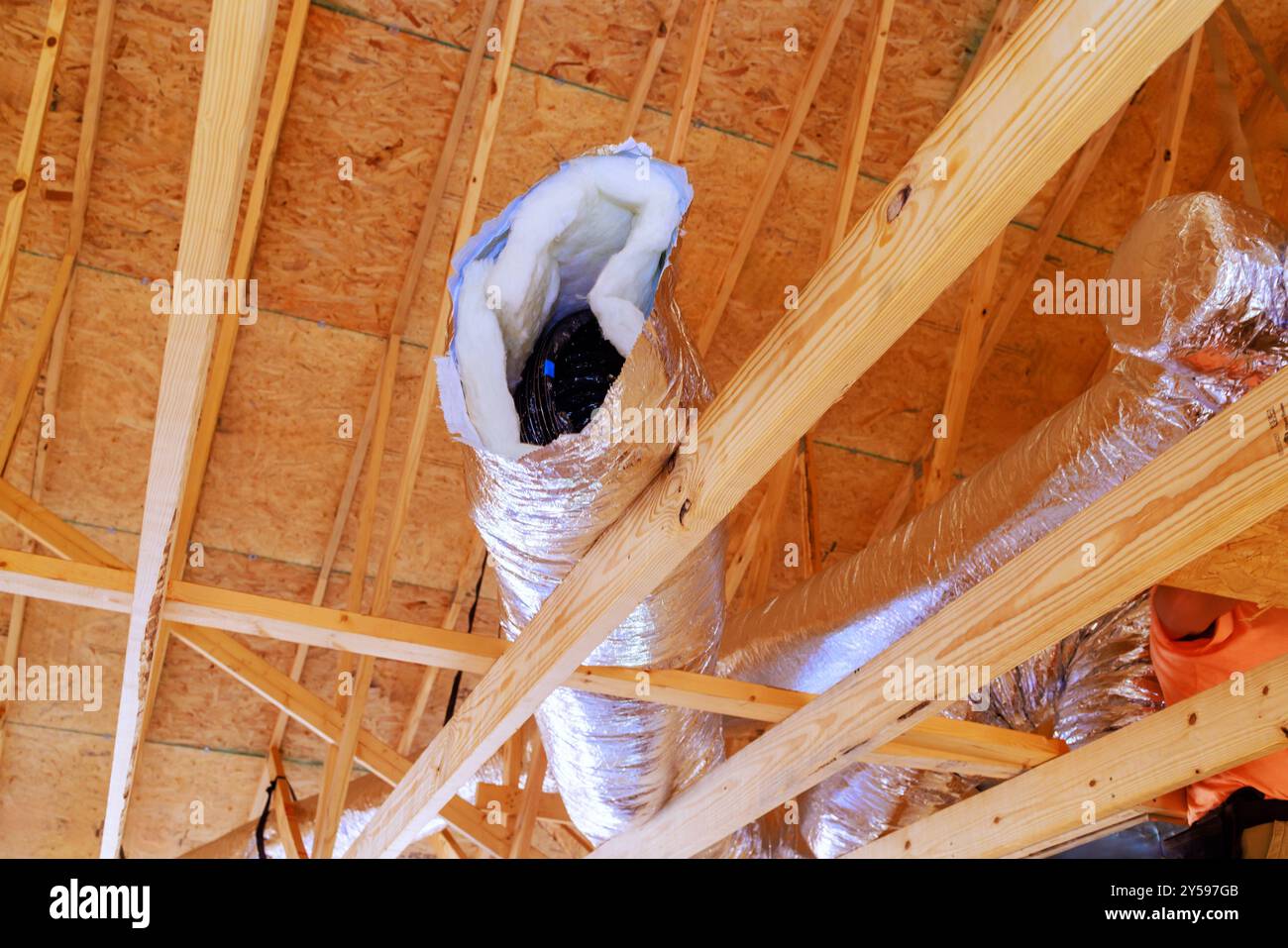 In construction of home, silver insulation ventilation HVAC pipes were ...