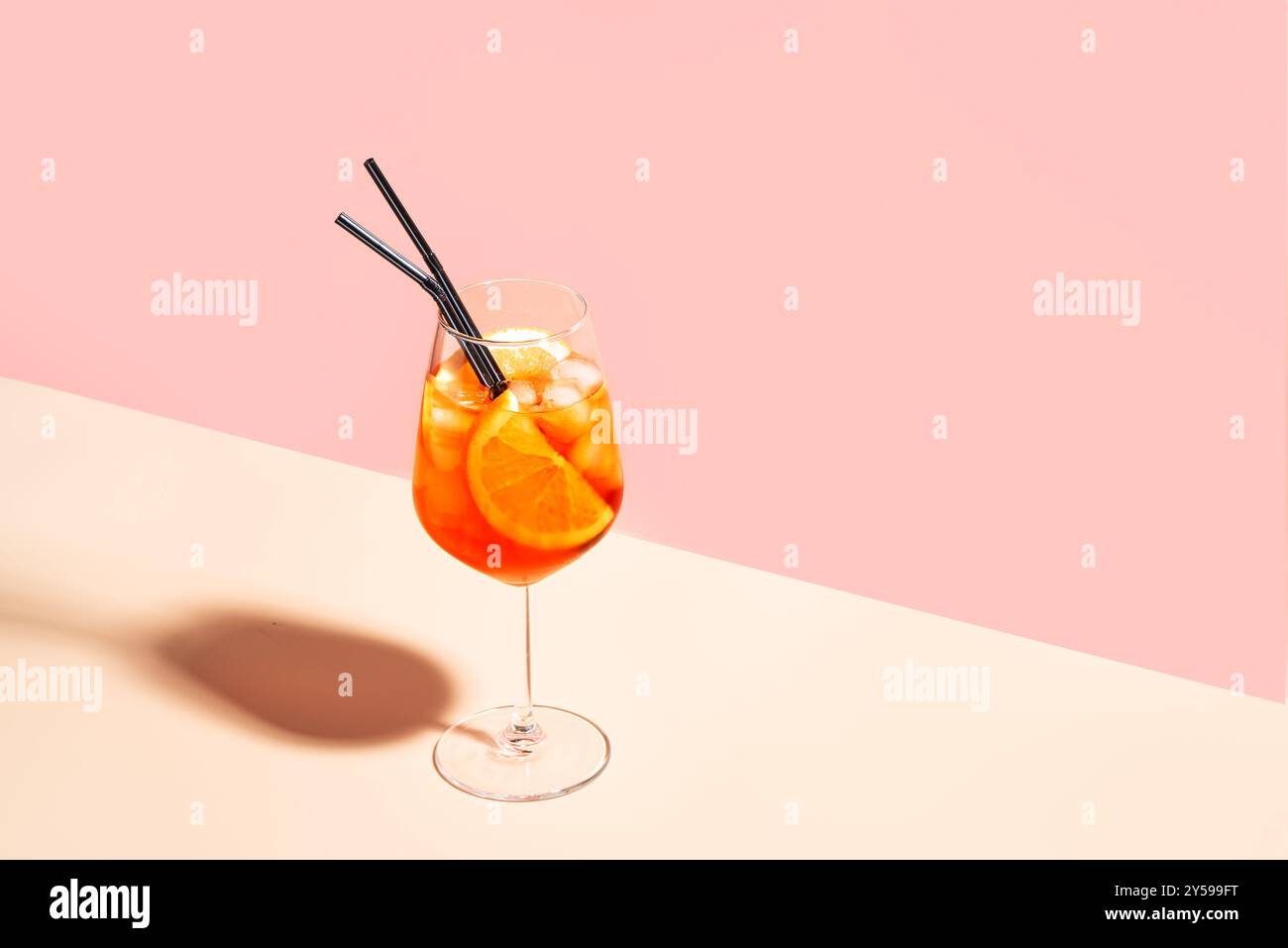 Aperol Spritz Cocktail in glass with orange slices on pink peach ...