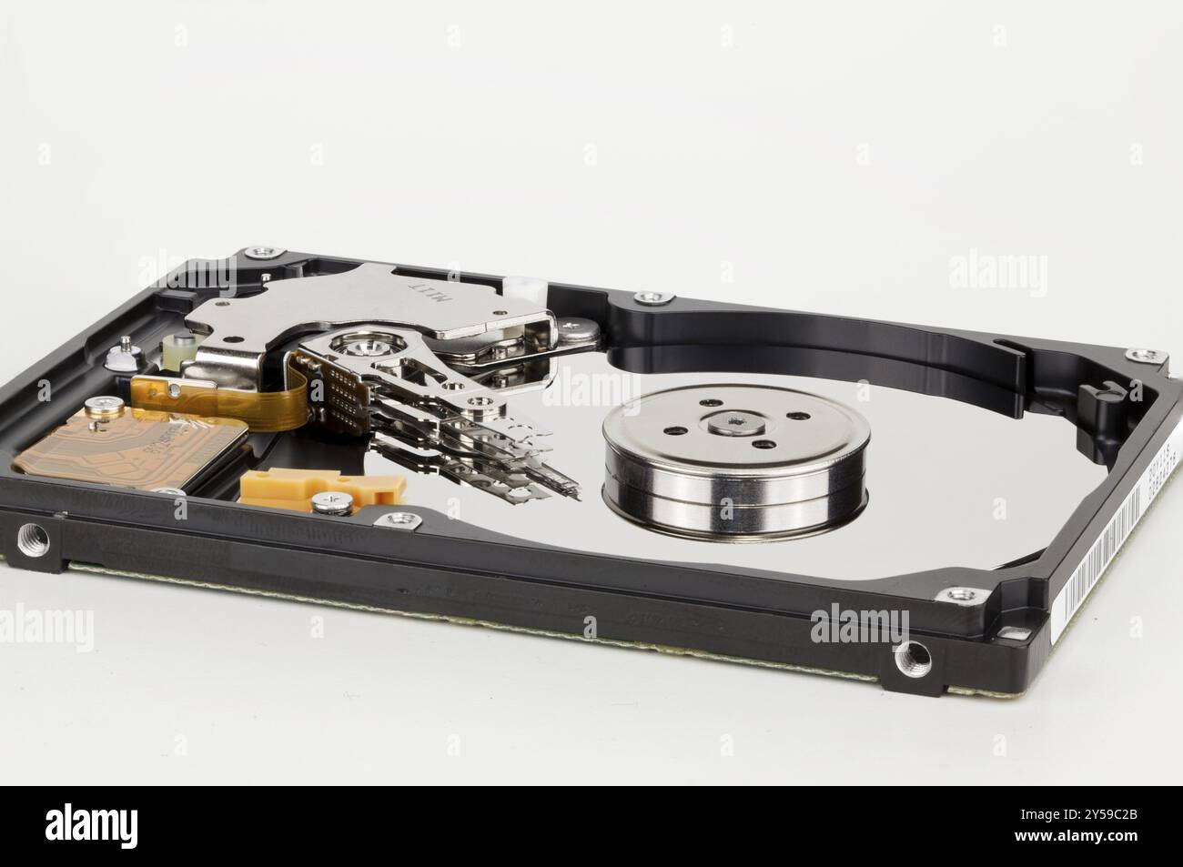 Open hard disc with visible read/write head Stock Photo - Alamy