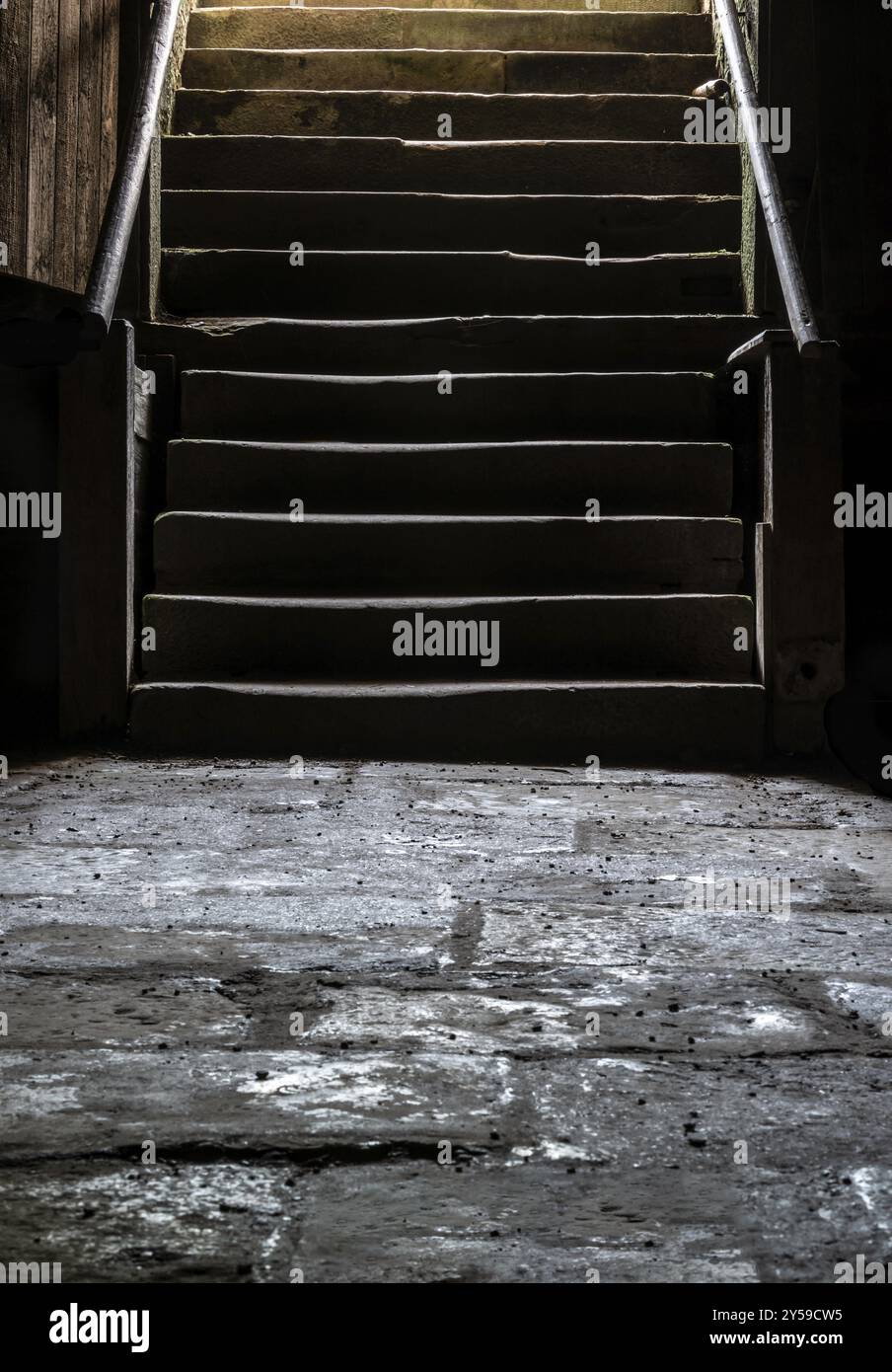 Interior image from a medieval cellar with the stone floor and stairs ...