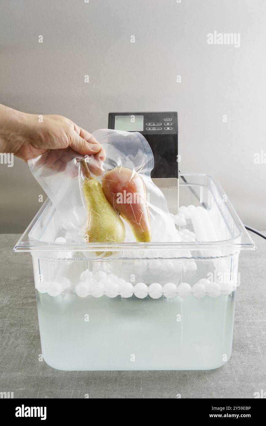 Sous vide cooking of pears in a sous vide precision immersion cooker ...