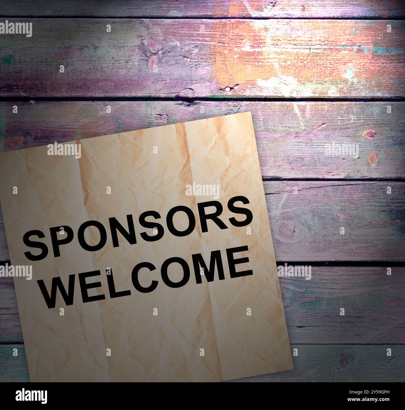 Sponsors welcome words written on white paper pieces with background ...