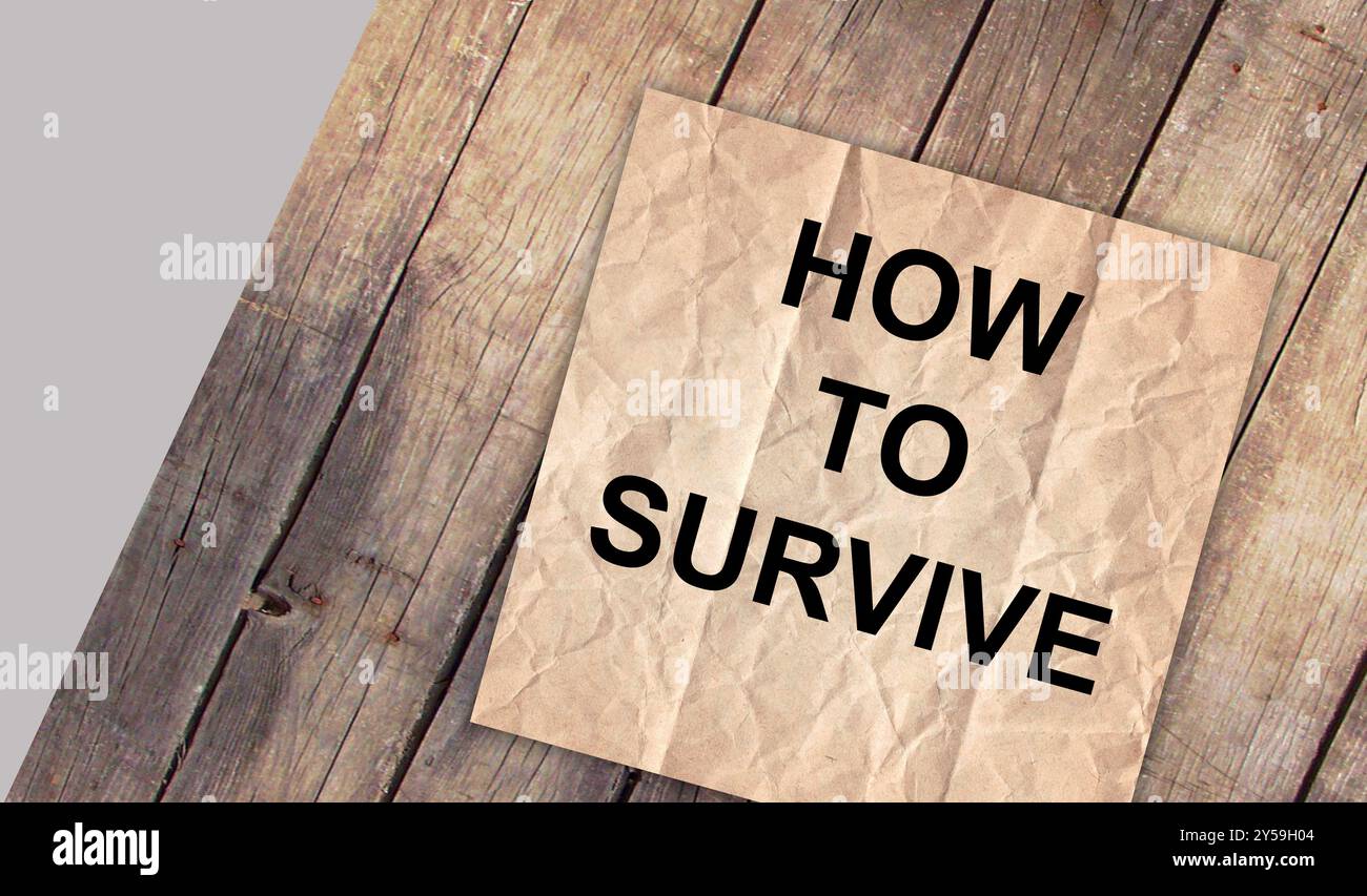 How To Survive text written on paper torn top view on background ...
