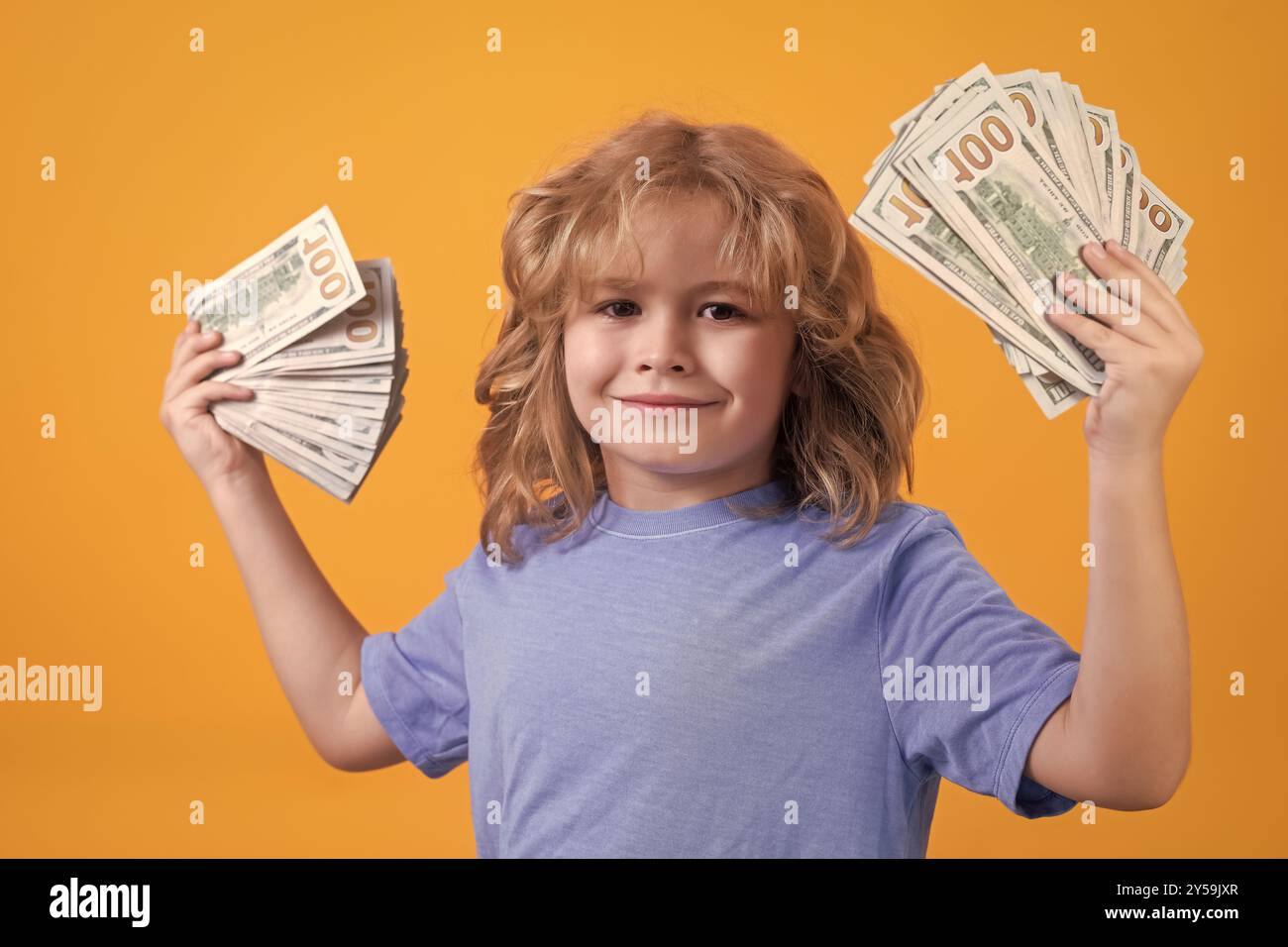 Happy rich kid boy with money dollars cash Stock Photo - Alamy