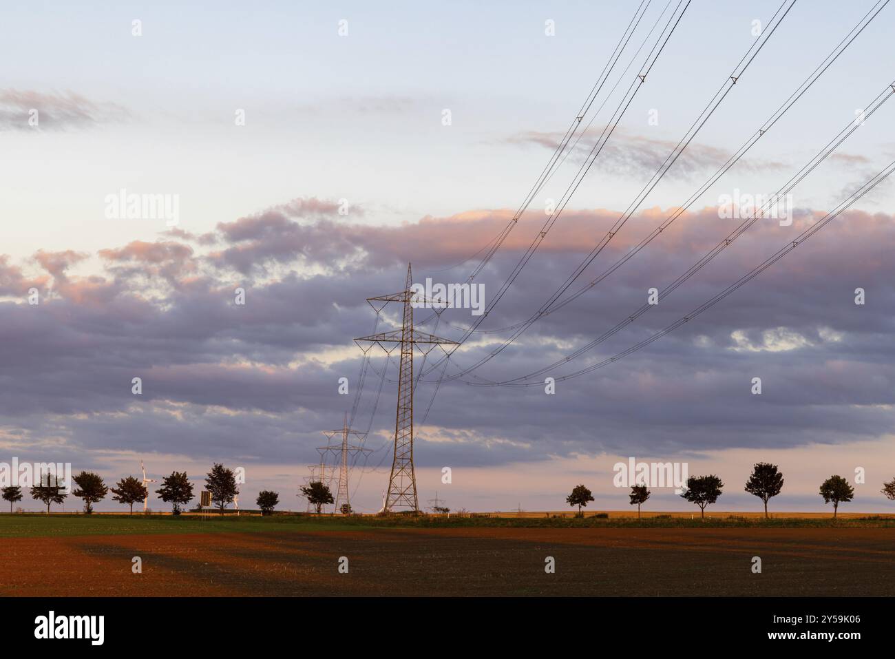 Power lines in setting sun hi-res stock photography and images - Alamy