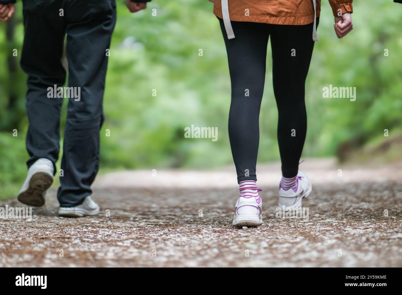 Father and daughter walking in nature lower body crop Stock Photo - Alamy