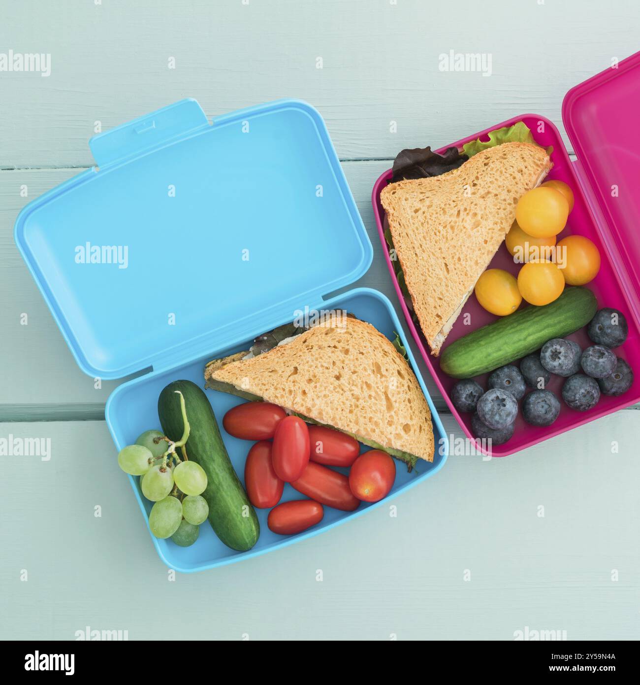 Healthy school lunch boxes for children with sandwich and fresh ...