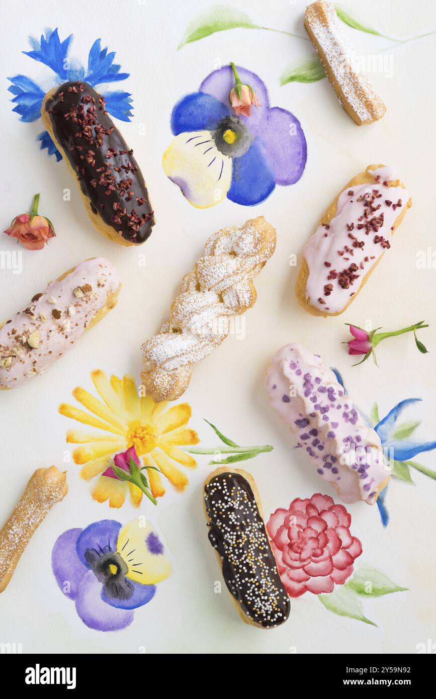Eclairs with chocolate ganache and icing with different toppings on ...