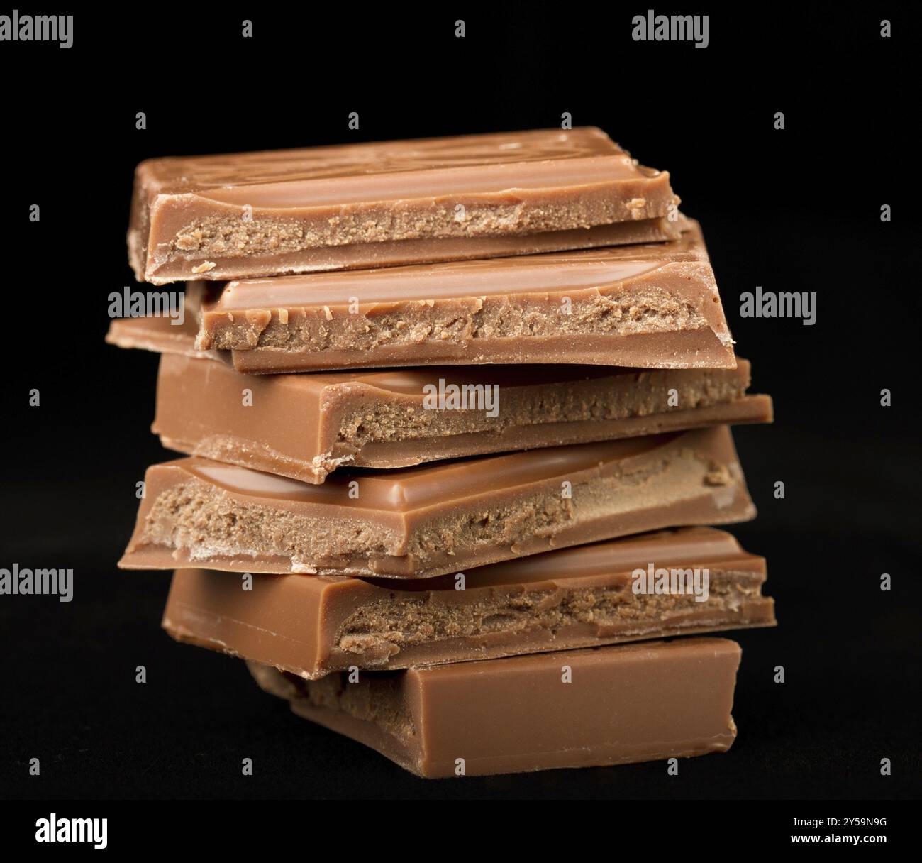 Close-up of chocolate stack with black background Stock Photo - Alamy