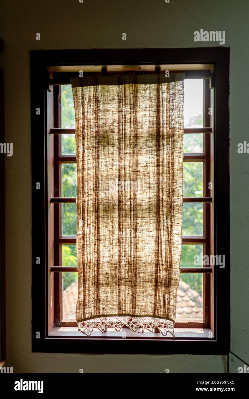 Vintage brown curtain and closed old fashioned wooden window Stock ...