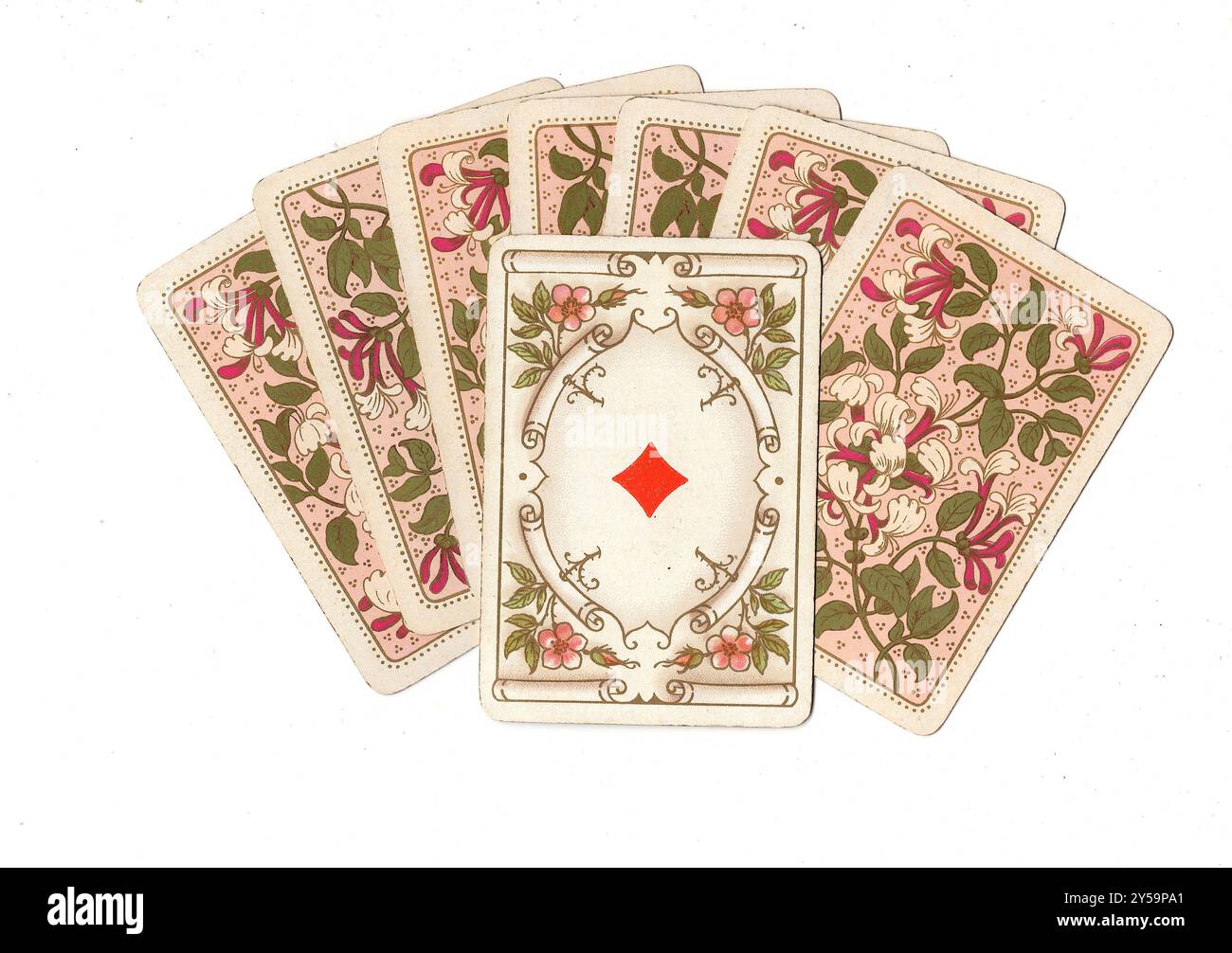 A fan of vintage card backs with one picture card revealed on a white ...