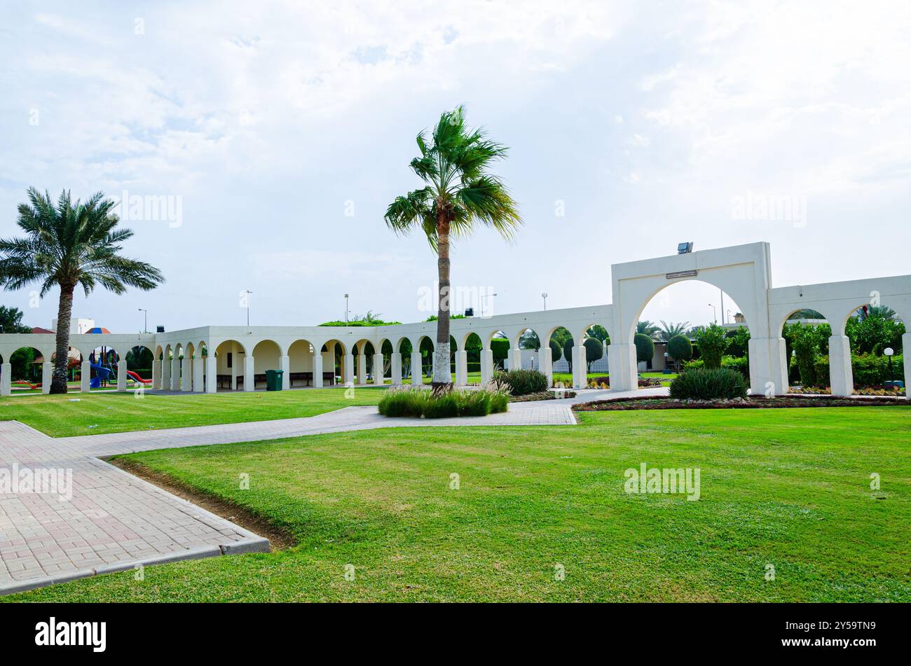 Arches and palms of the Al Ruwais park in Qatar Stock Photo - Alamy