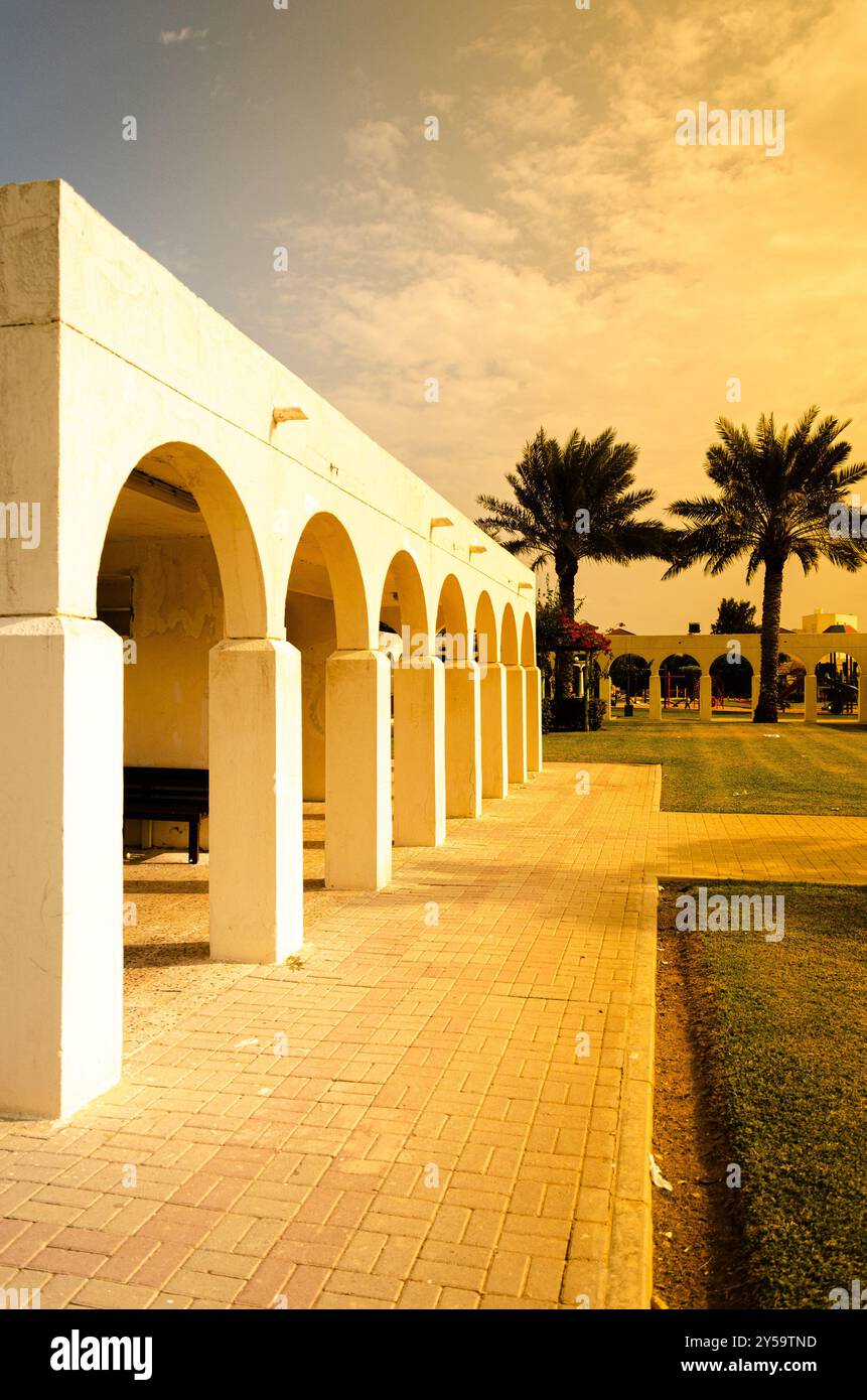 Arches and palms of the Al Ruwais park in Qatar Stock Photo - Alamy