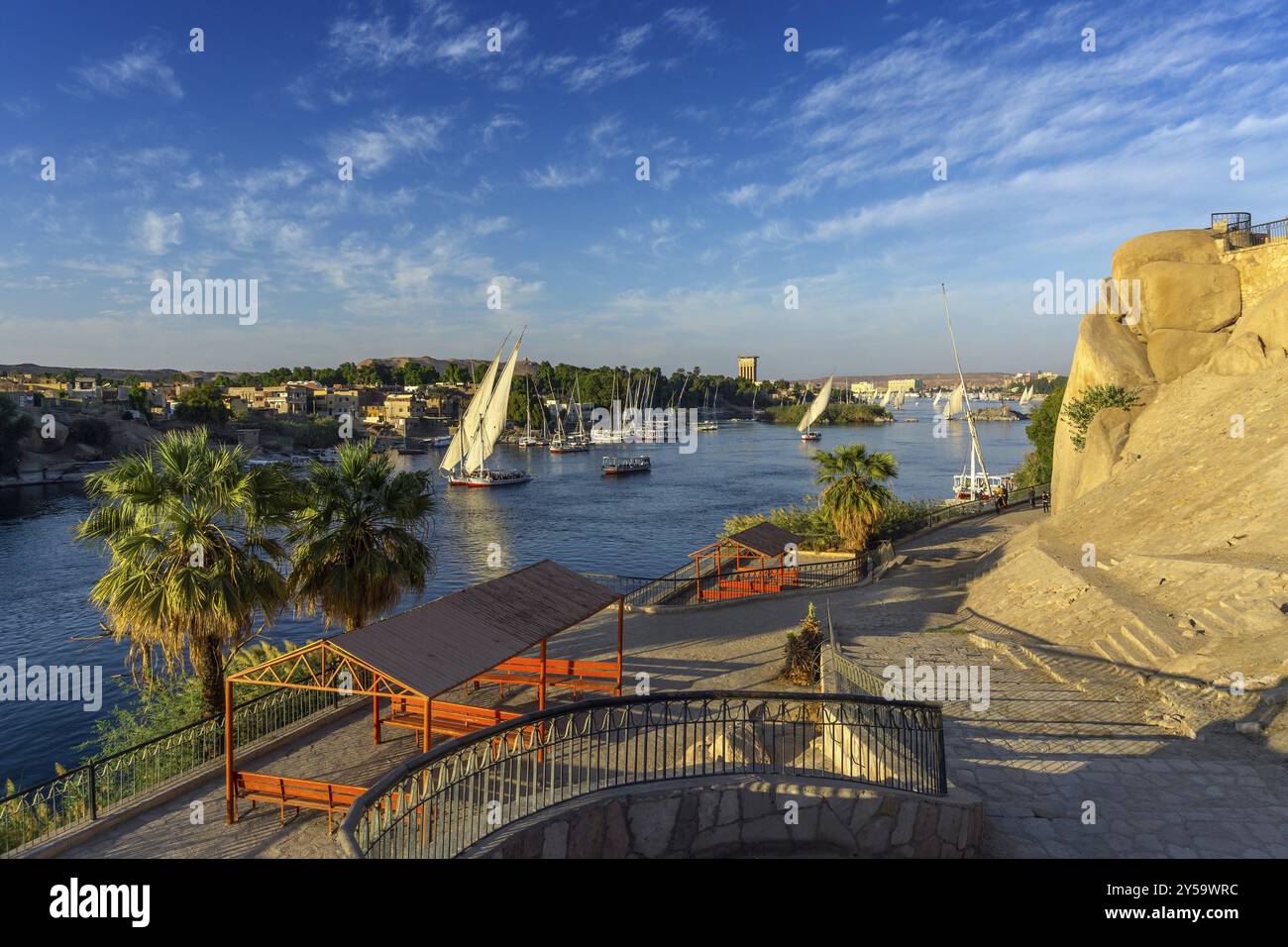Beautiful landscape with felucca boats on Nile river in Aswan at sunset ...