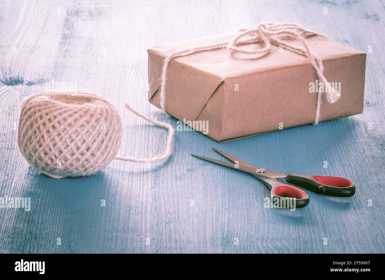 Gift box homemade, wrapped in classic brown paper, ball of string and ...