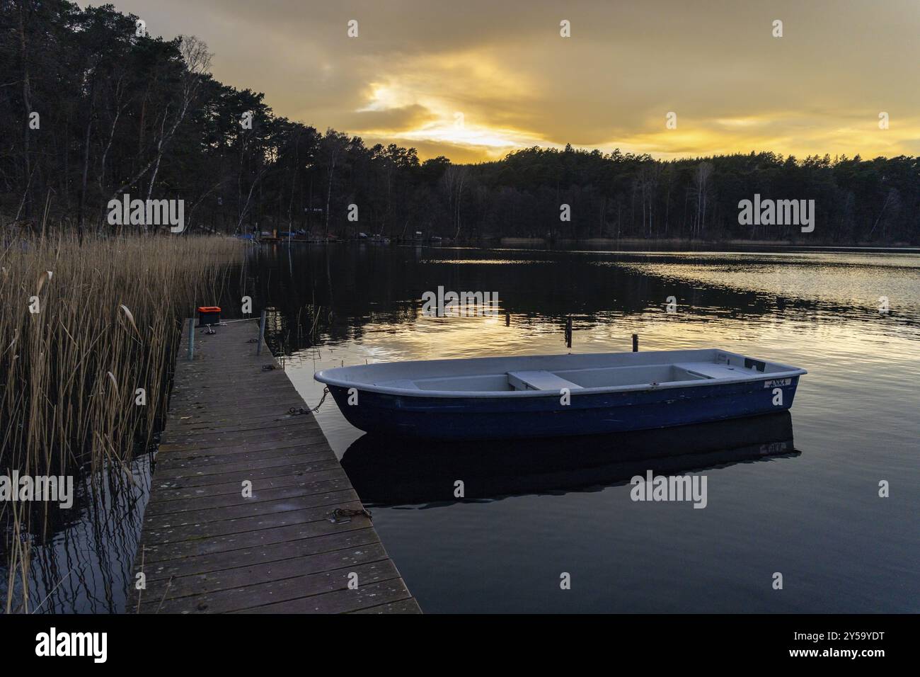 Fishing boat full of water in the lake Stock Photo - Alamy