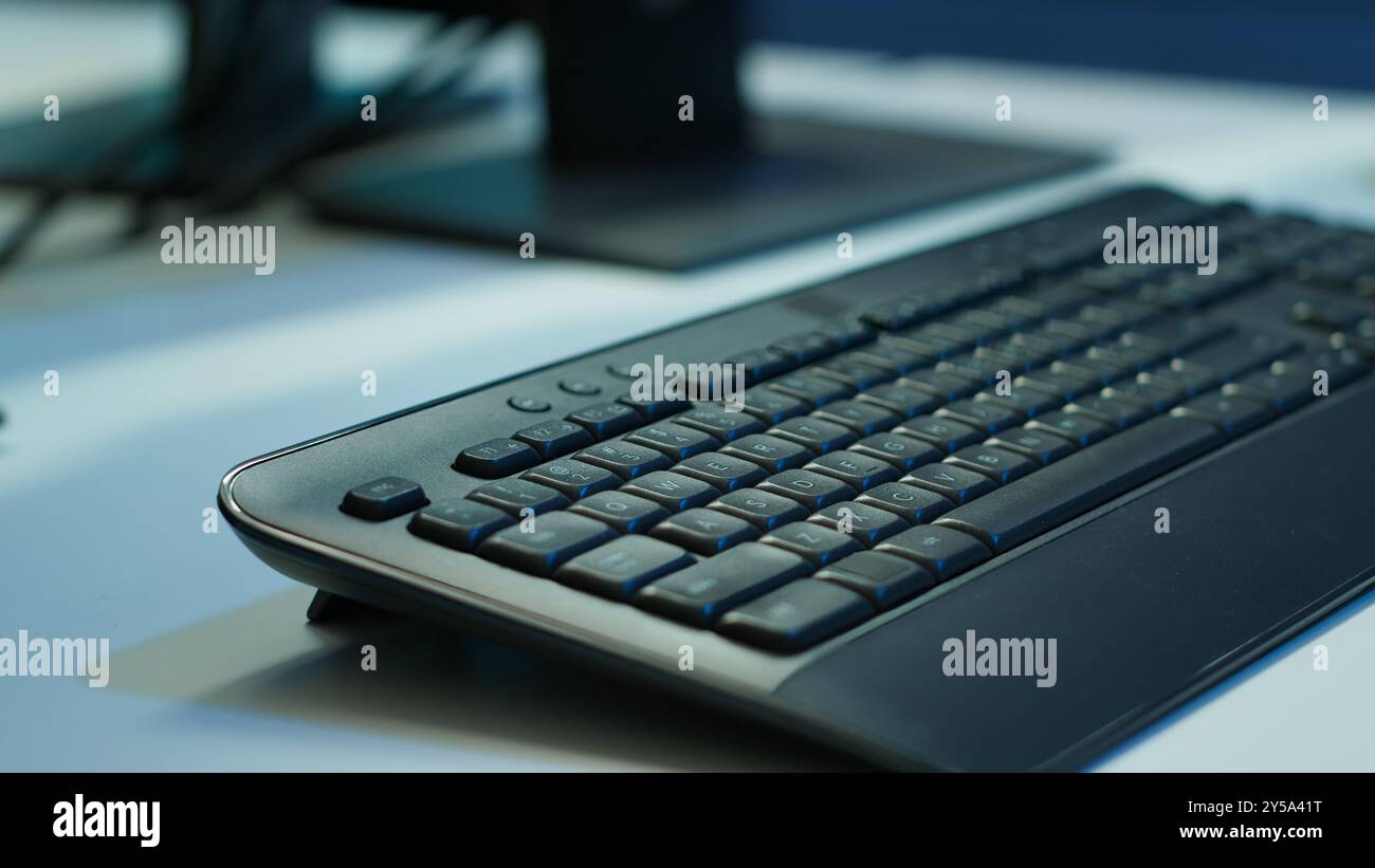 Extreme close up shot of computer displays on desk in server farm used ...