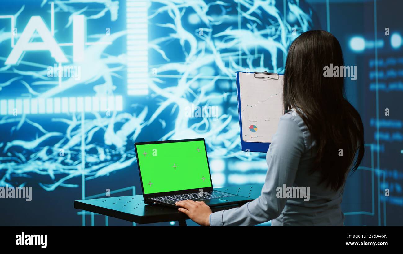 IT specialist using green screen laptop and AI technology for business ...