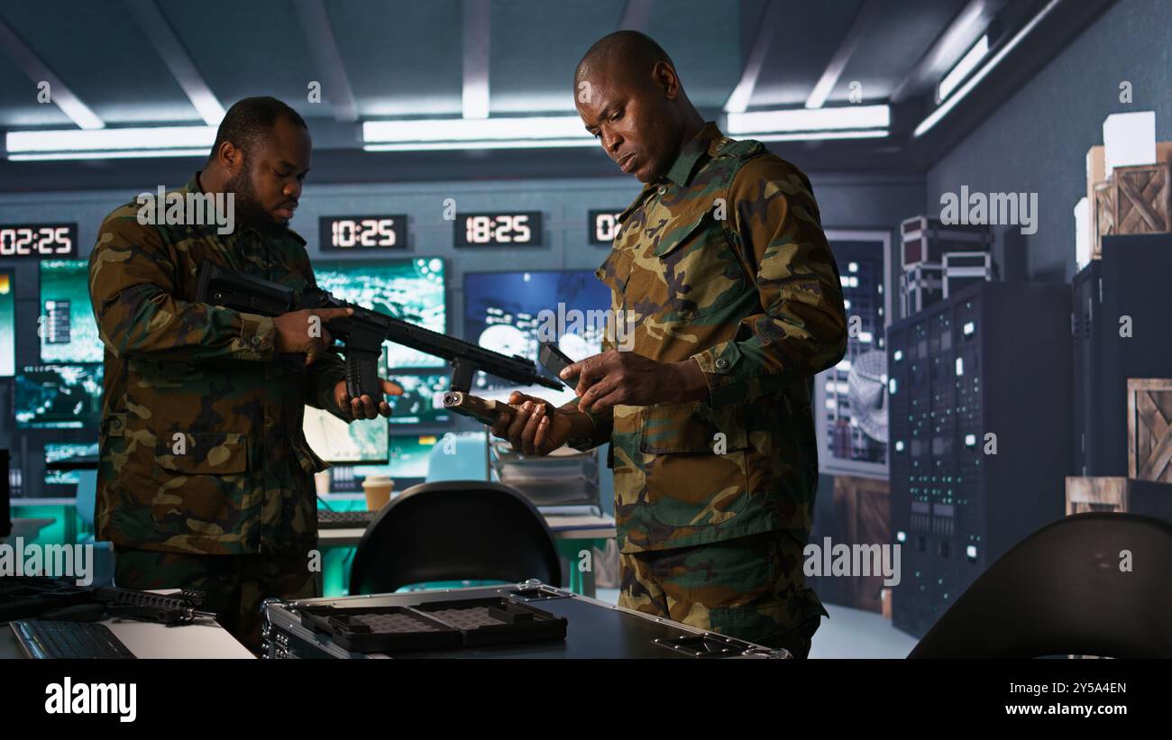 Operatives conducing special operation, doing checkup on rifles and ...