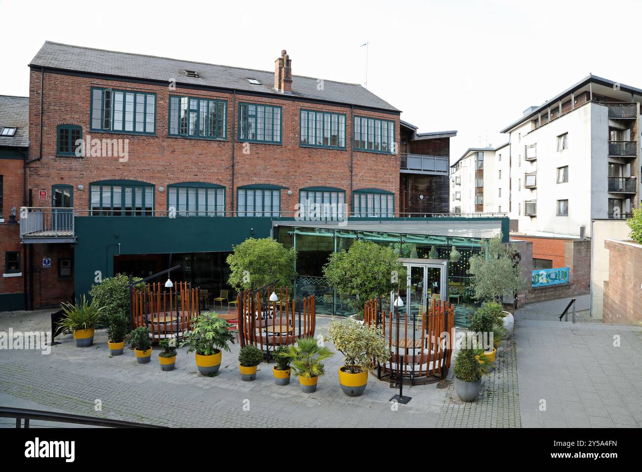Apartments and restaurant developed from a former ribbon weaving ...