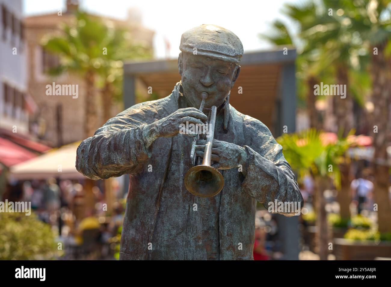 Kusadasi, Turkey - 1 September 2024: Bronze statue of a trumpet player ...