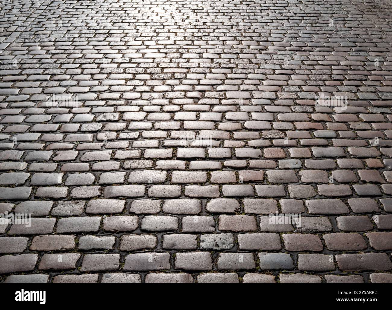 Pavement road. Background of bricks road. Stone cladding pavement ...