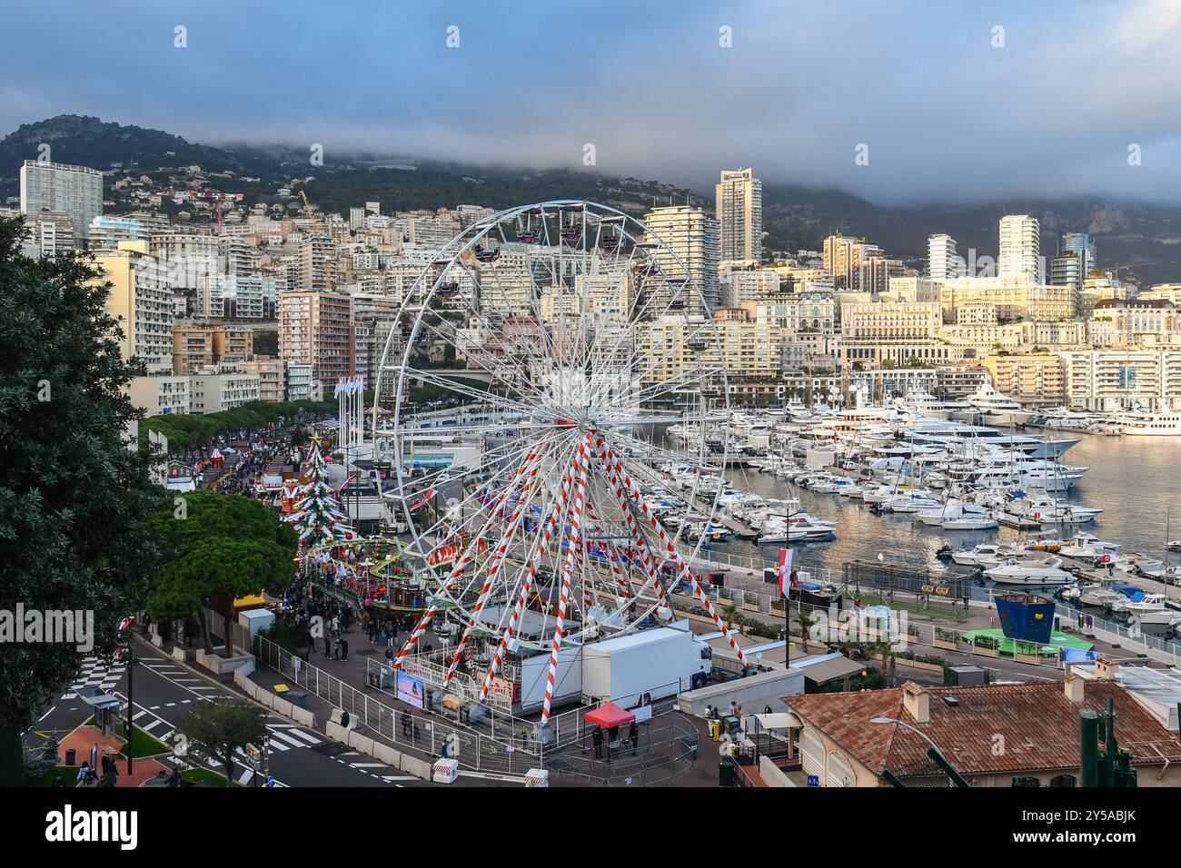 Elevated view of Port Hercule with the ferris wheel and the Christmas ...