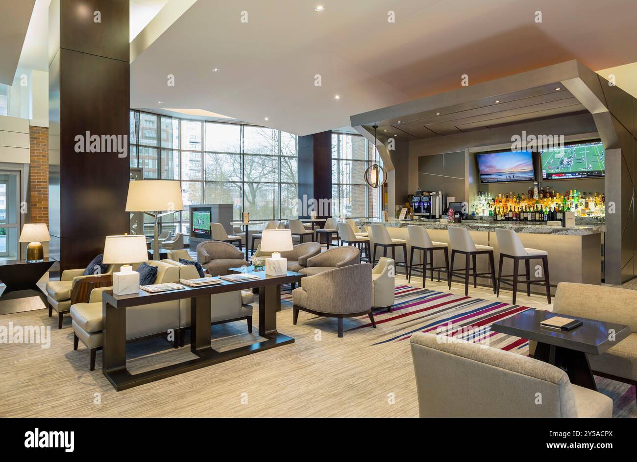 Monochromatic beige color scheme with stripes of color in carpeting hi ...