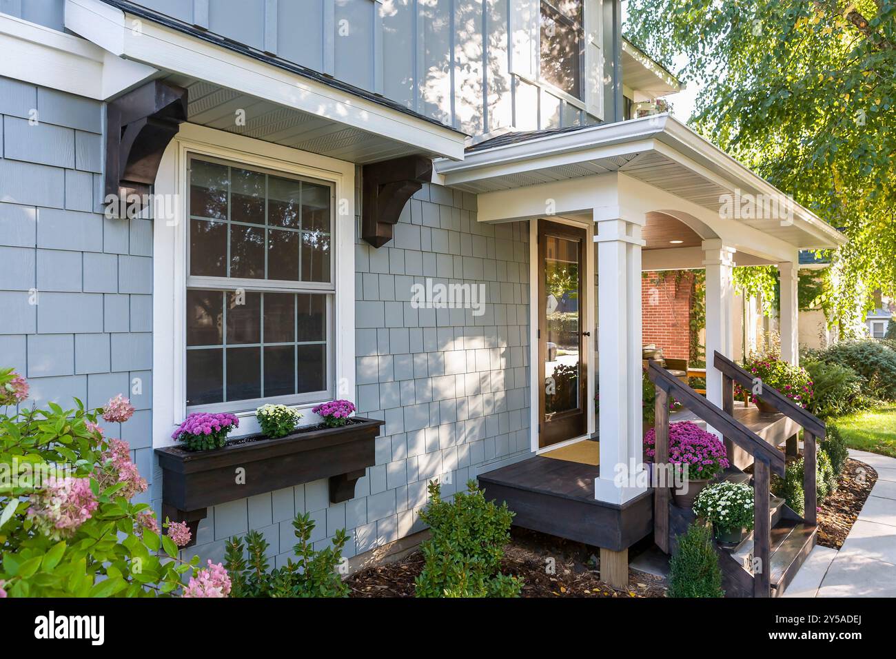 Front porch of house seen from angle with dappled sunlight Stock Photo ...