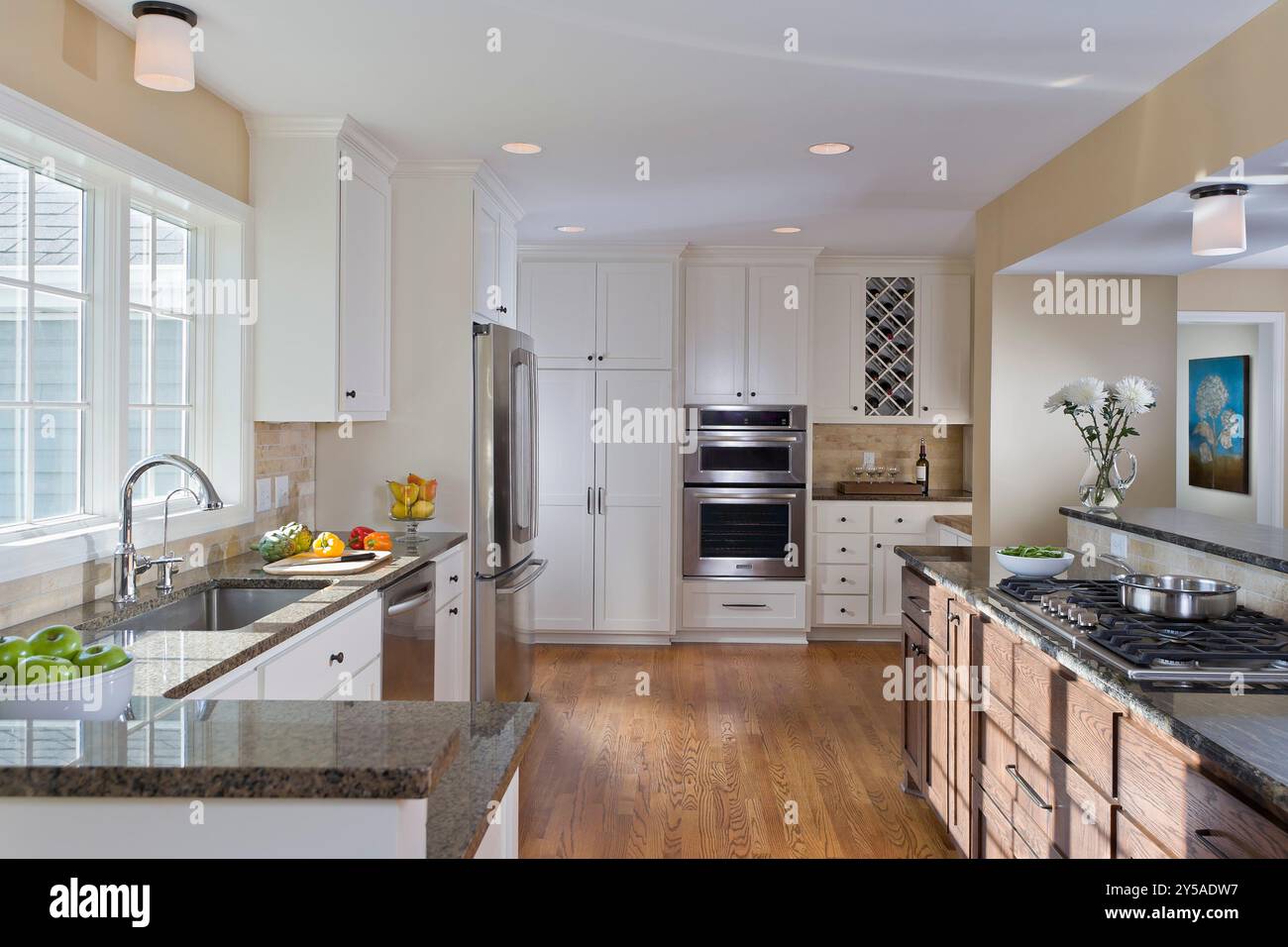 White cabinets combined with natural stained wood cabinets hi-res stock ...