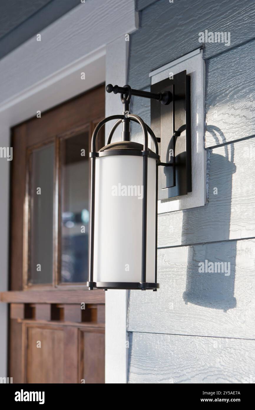 Outdoor light fixture on front porch Stock Photo - Alamy