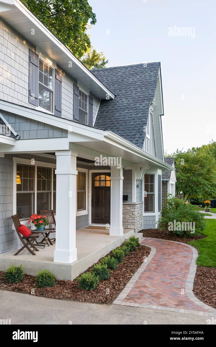 Gray shingle house seen from front angle showing front porch Stock ...