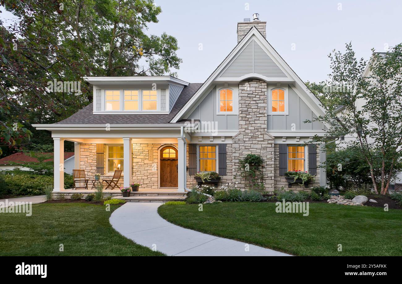Front of house photographed at dusk with interior lights on Stock Photo ...