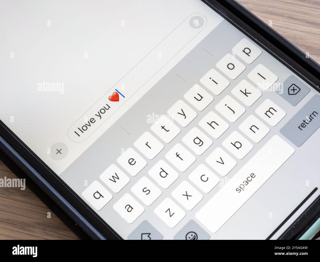 A close-up photo of a smartphone screen displaying a romantic text ...