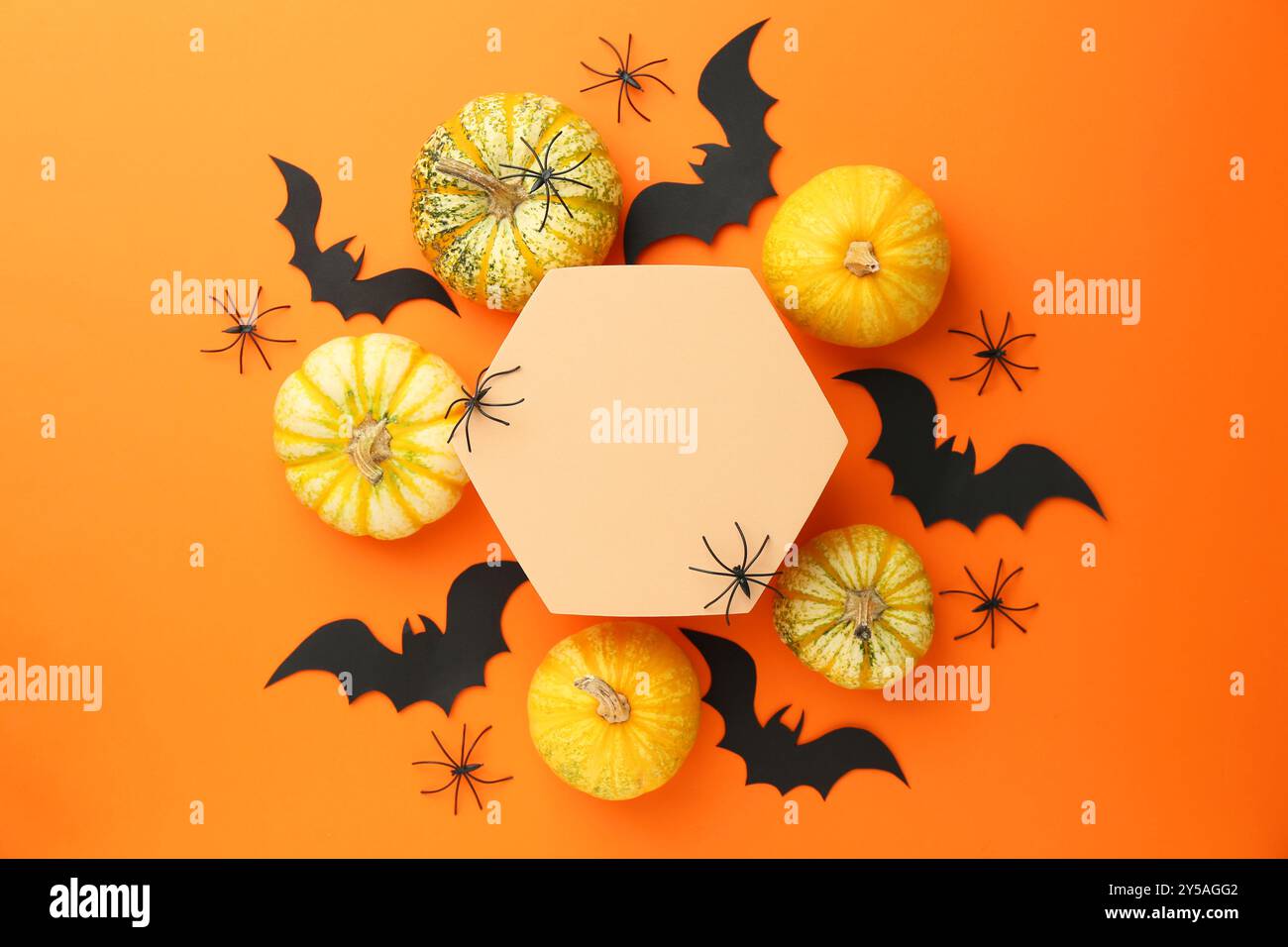 Halloween celebration. Black paper bats, spiders, pumpkins and podium ...