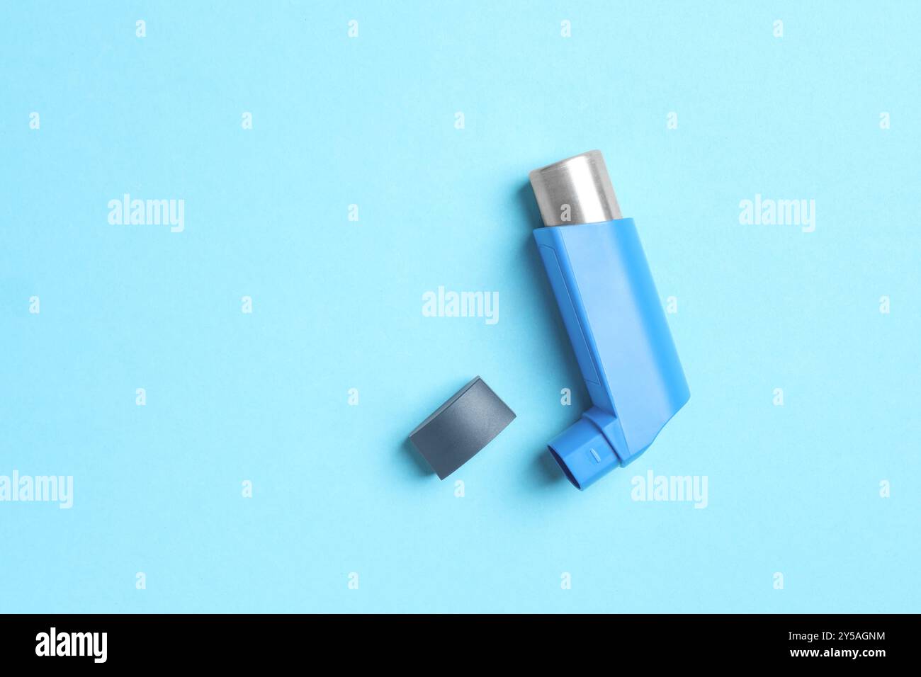 Asthma inhaler on light blue background, top view. Space for text Stock ...