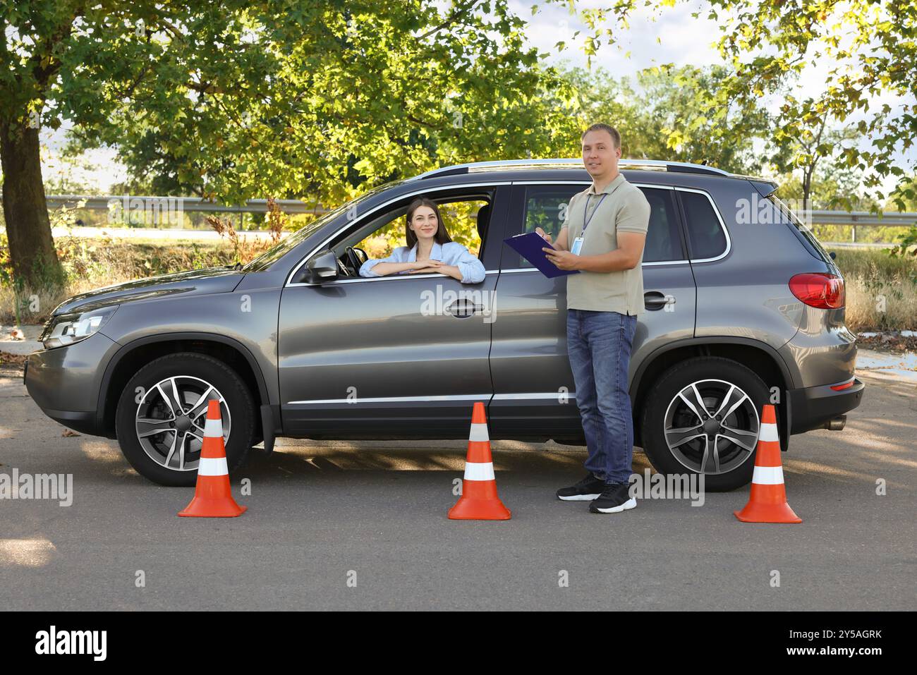 Woman passing maneuverability driving test on track Stock Photo - Alamy