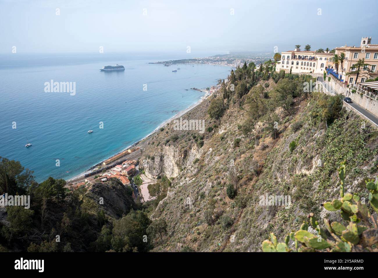 Taormina, Italy - June 19, 2024: Overlooking Taormina's coastal charm ...