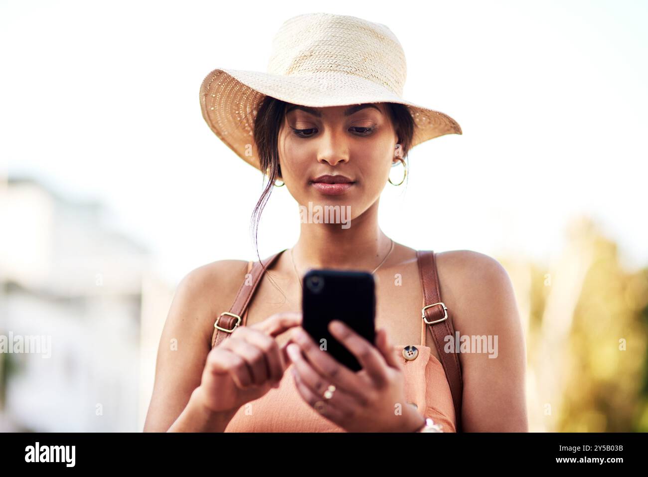 Woman, phone and travel in city street for location guide, navigation ...