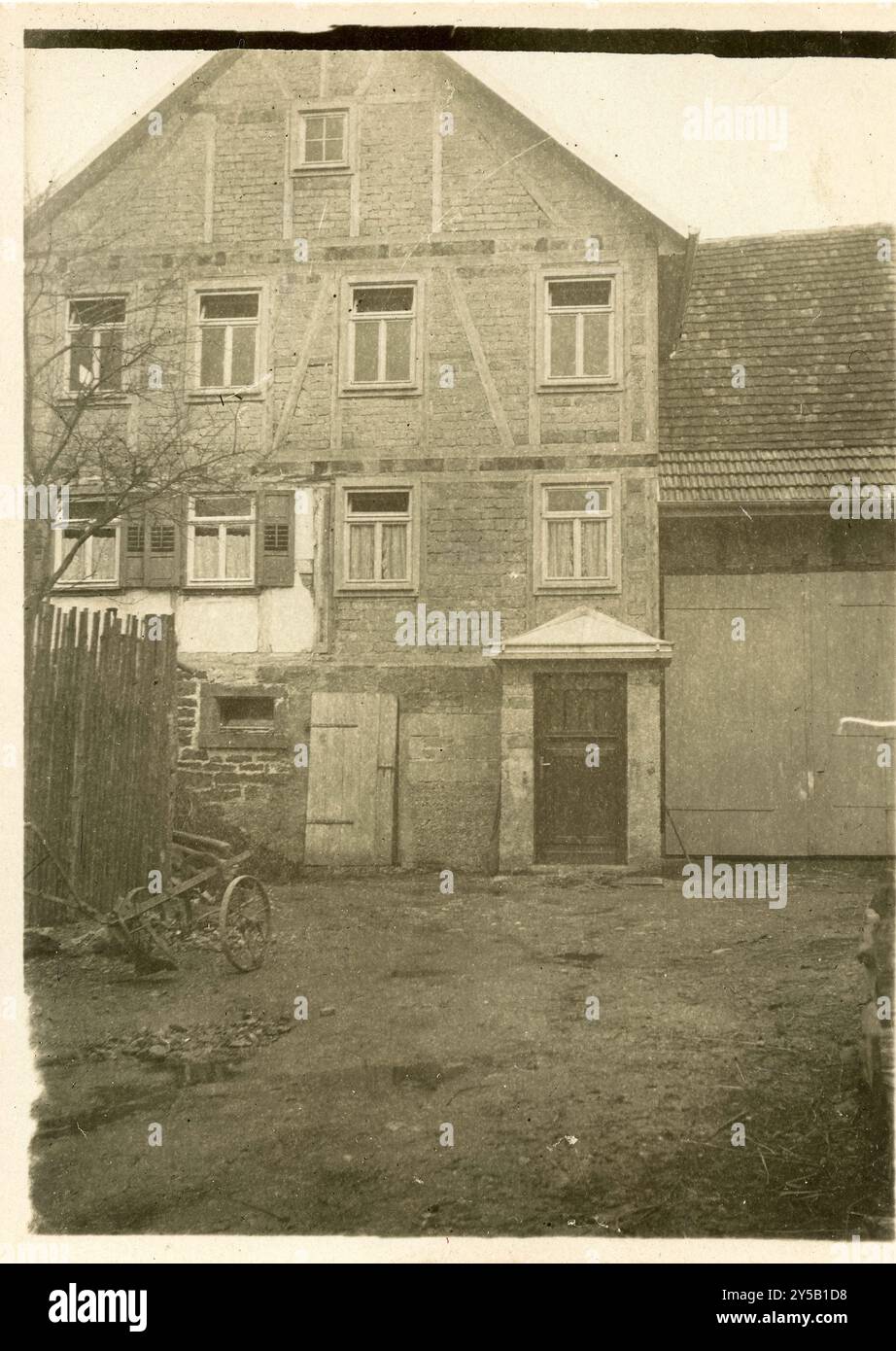A traditional timber-frame house, possibly from the early 1900s ...