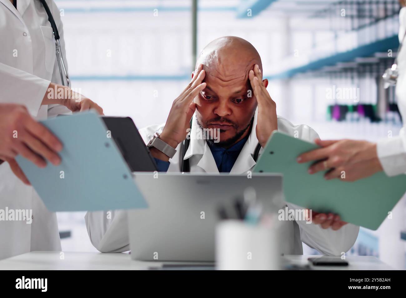 Stress At Workplace In Office. Business Headache Stock Photo - Alamy