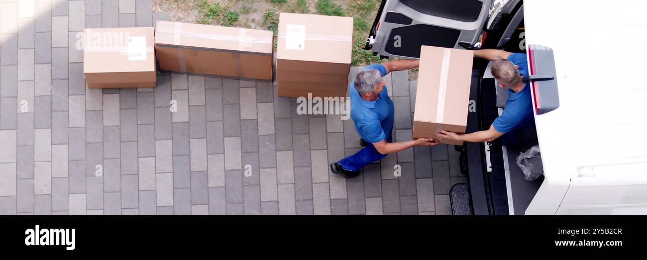 Man carrying heavy load boxes hi-res stock photography and images - Alamy